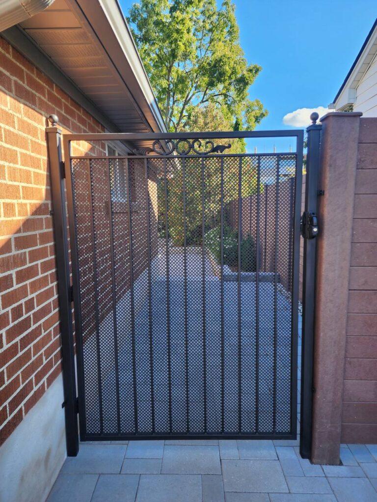 Perforated Metal Fence and Gate in Toronto. Panels, Facade